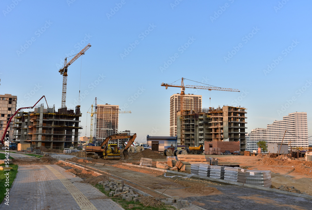 Construction site. Tower cranes in action. Formworks and pouring ...