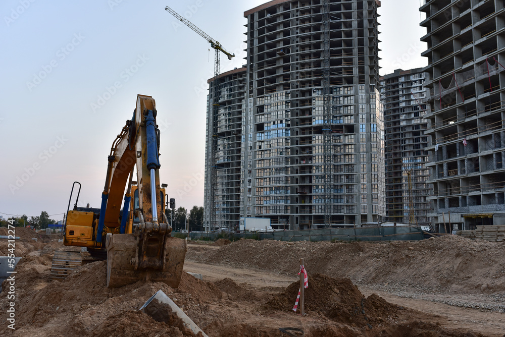 Sewer pipes laying. Sanitary drainage, external sewage. Tower crane on ...