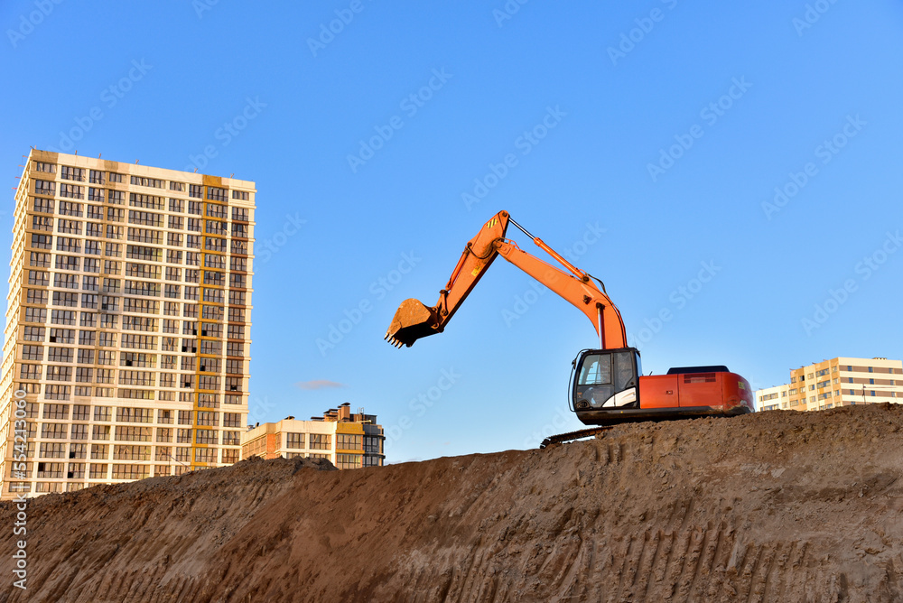 Excavator dig ground at construction site. Dig foundation. Construction ...