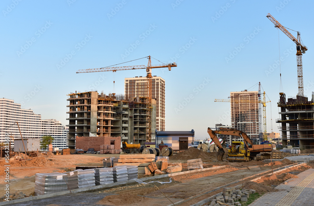 Construction site. Tower cranes in action. Formworks and pouring ...