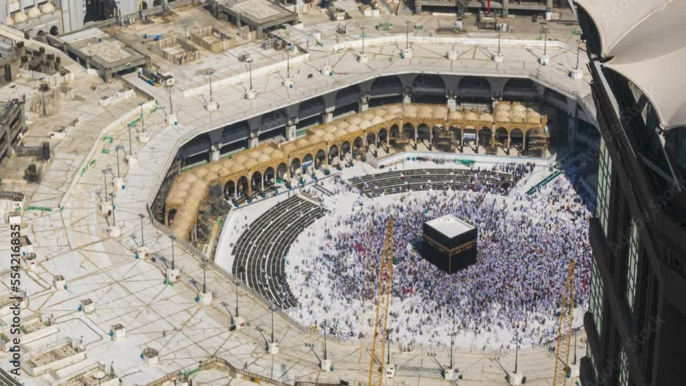 Time lapse of Muslim pilgrims circling around the holy Kaaba at noon ...