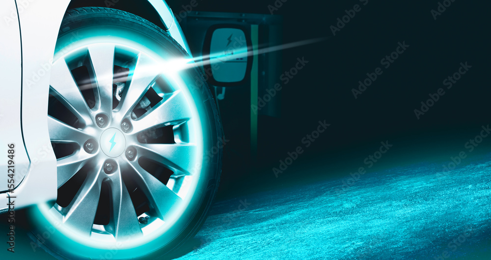 EV electric vehicle parked with a blue neon light on the wheels ...