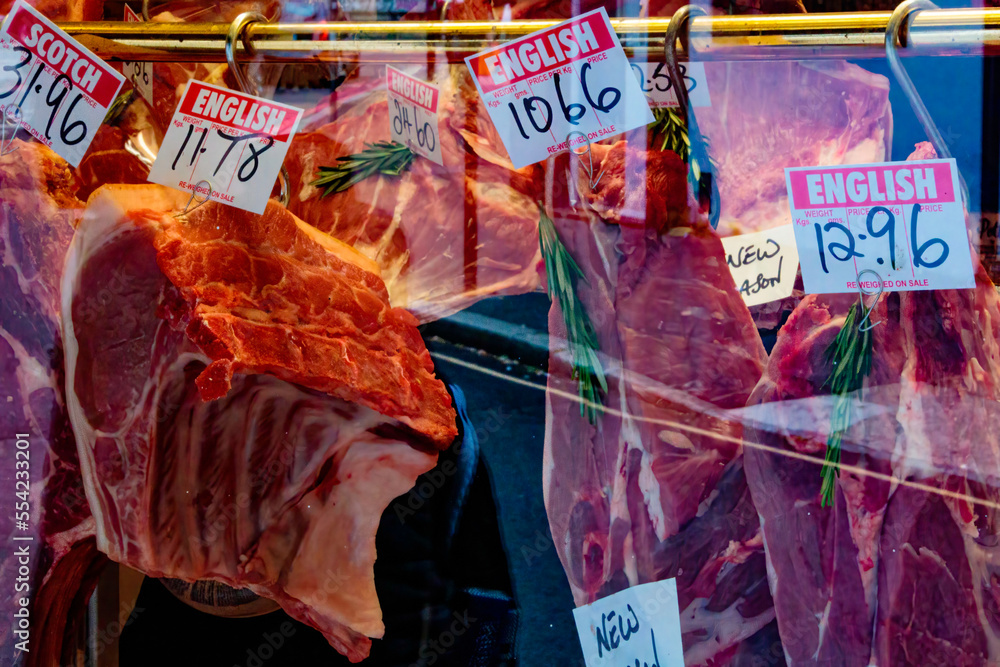Window display of a British butcher showing various types of meat and ...