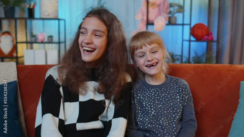 Happy teenage child and little sister kid laughing out loud after ...