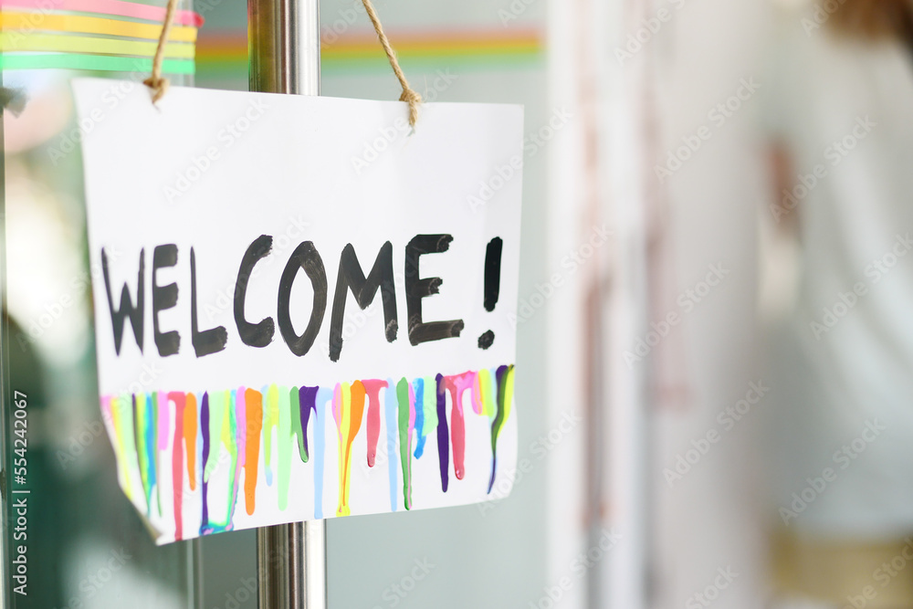 welcome hand written text on paper hanging on cafe door Stock Photo ...