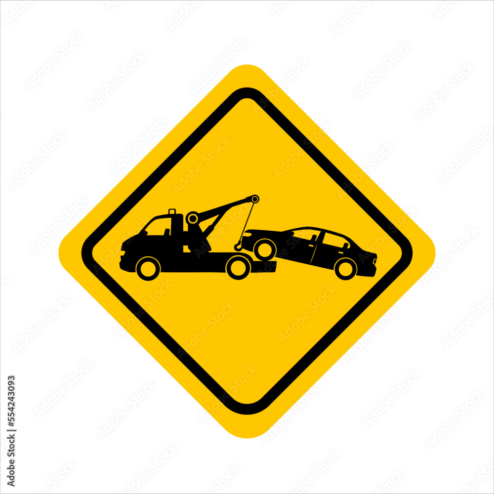 Sign of a tow truck yellow in the form of a rhombus. Warning tow away ...