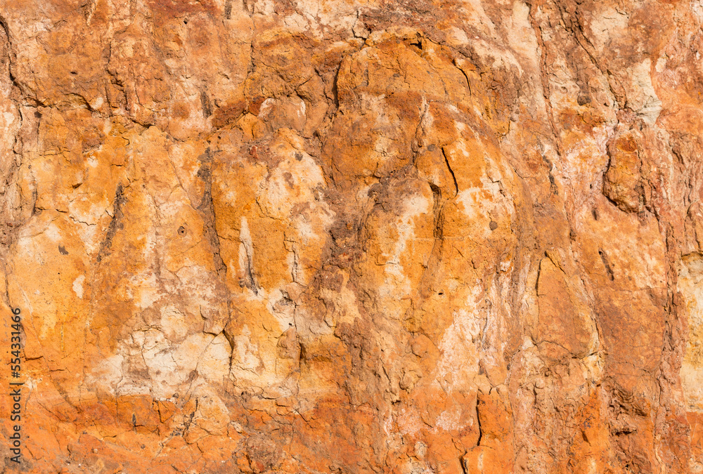Sedimentary rocks with a high content of iron oxide. Red soil, loam ...