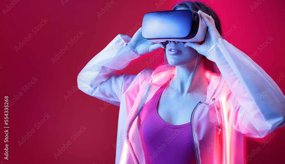 Woman in futuristic costume. Girl in glasses of virtual reality while ...