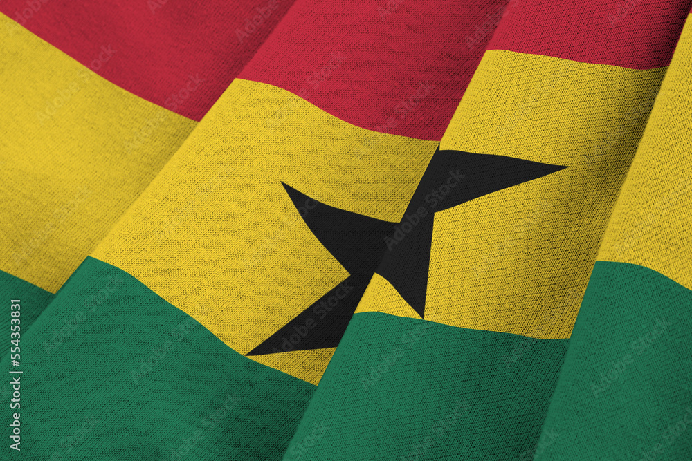 Ghana flag with big folds waving close up under the studio light ...
