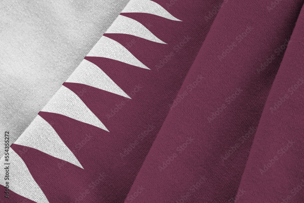 Qatar flag with big folds waving close up under the studio light ...