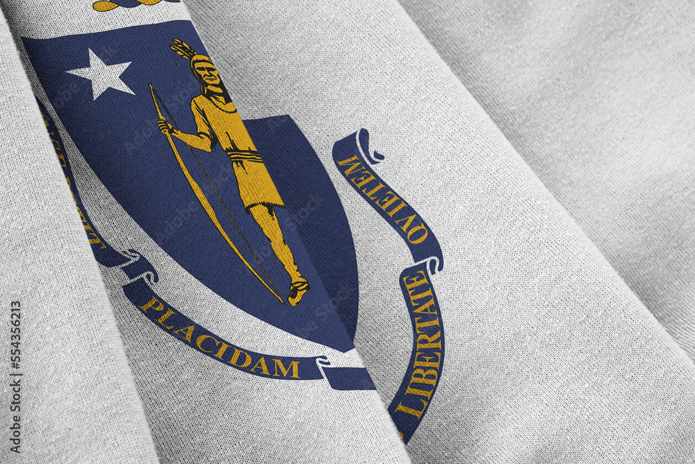 Massachusetts US state flag with big folds waving close up under the ...