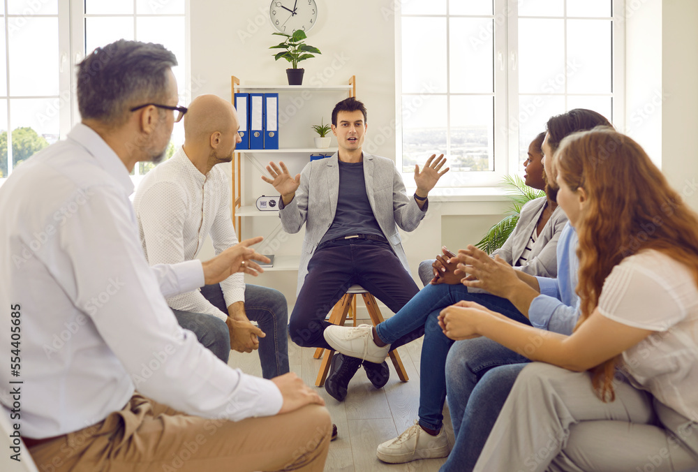 Business team talking during a work meeting in the office. Group of ...