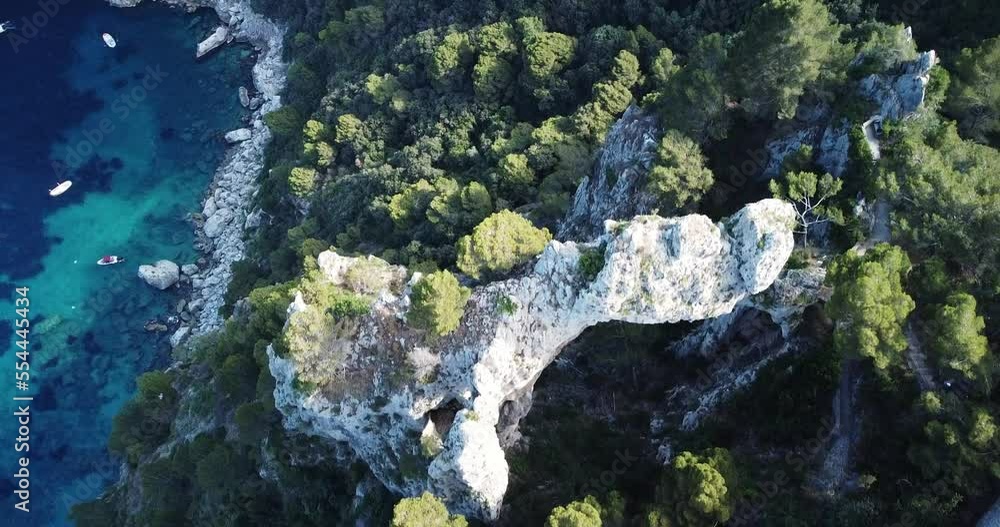 Limestone arch that forms a bridge between two pillars of rock Aerial ...