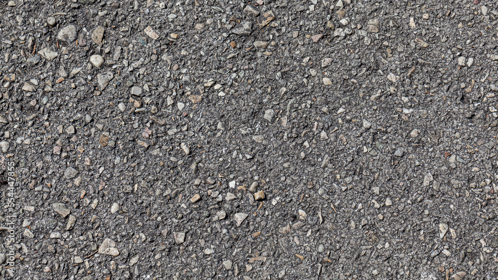 Weathered gray asphalt road texture in the sun, top view. gray tar road ...