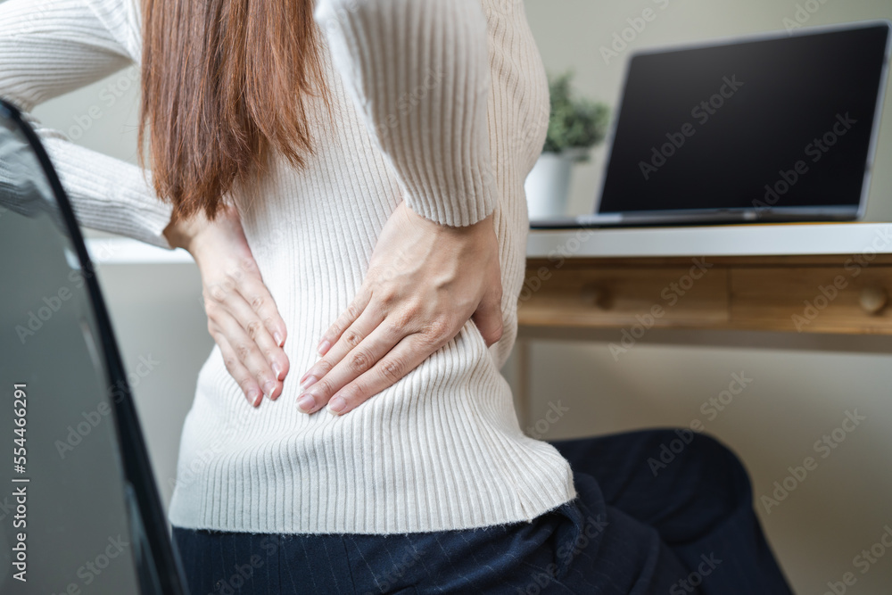 office syndrome, woman with back pain symptoms during work in the ...