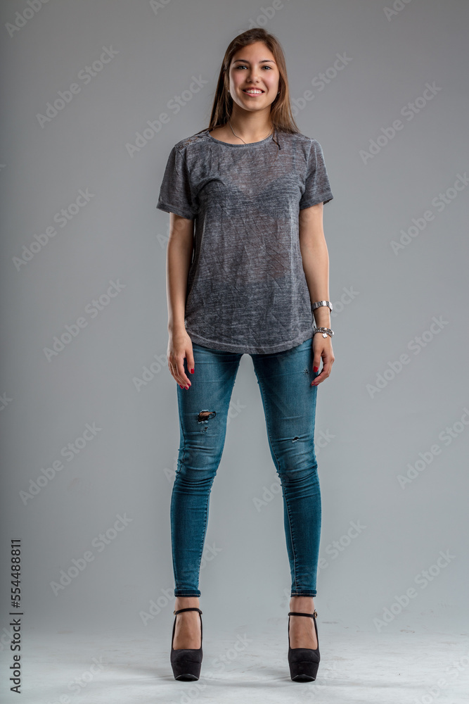 Full-length frontal portrait of girl with hands along her hips Stock ...