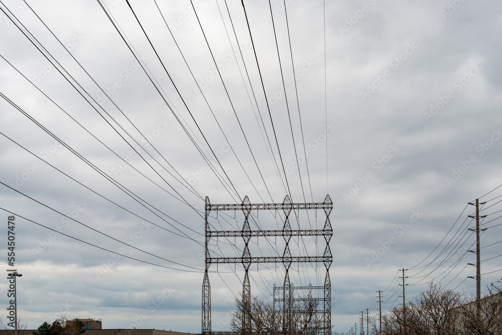 An electric utility pole with electrical wires, transmission lines ...