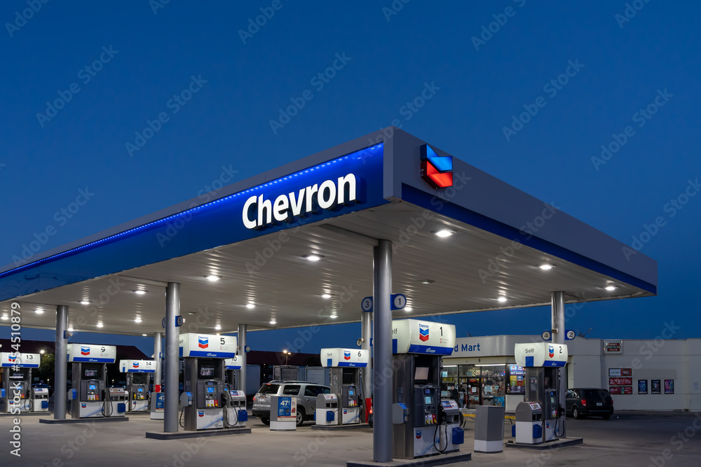 Dallas, Texas, USA - March 19, 2022: Night view of Chevron gas station ...