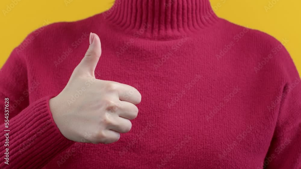 Woman makes hand sign like, thumb up gesture. Correct perfect choice ...