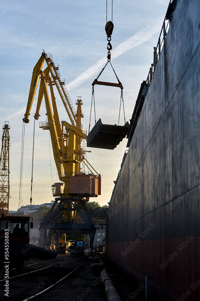 Loading cast iron ingots on ship bulk. Loading metal on ship ...