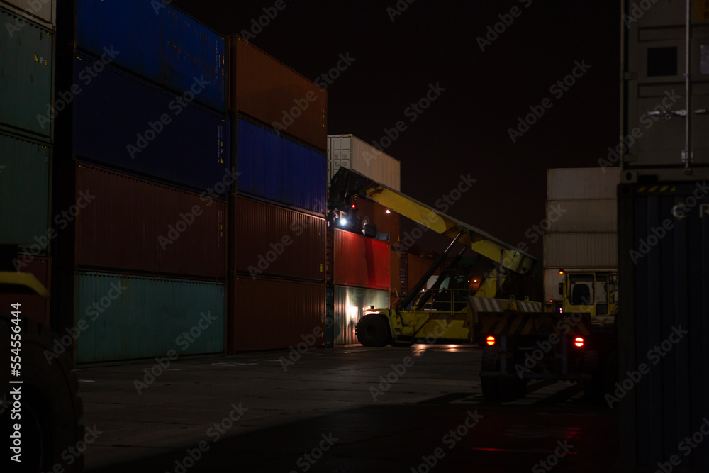 Reach Stacker during operation. Reach-stacker container loader during ...
