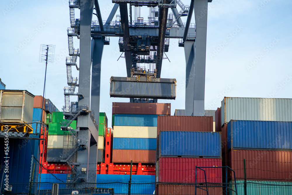 Container port with container ship. berthing crane loads container onto ...