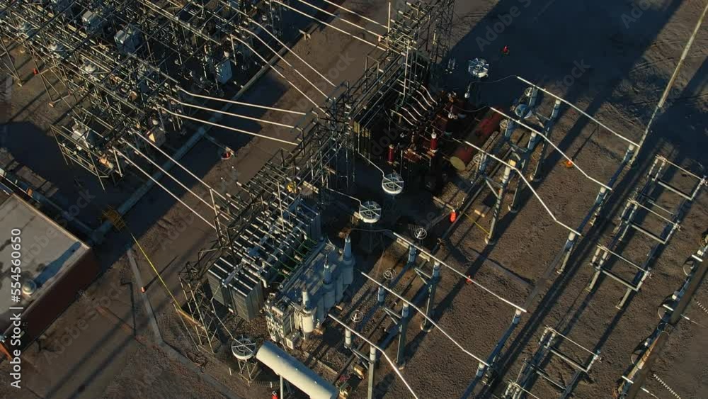 High voltage power grid station. Slow panning. Pylons and high voltage ...