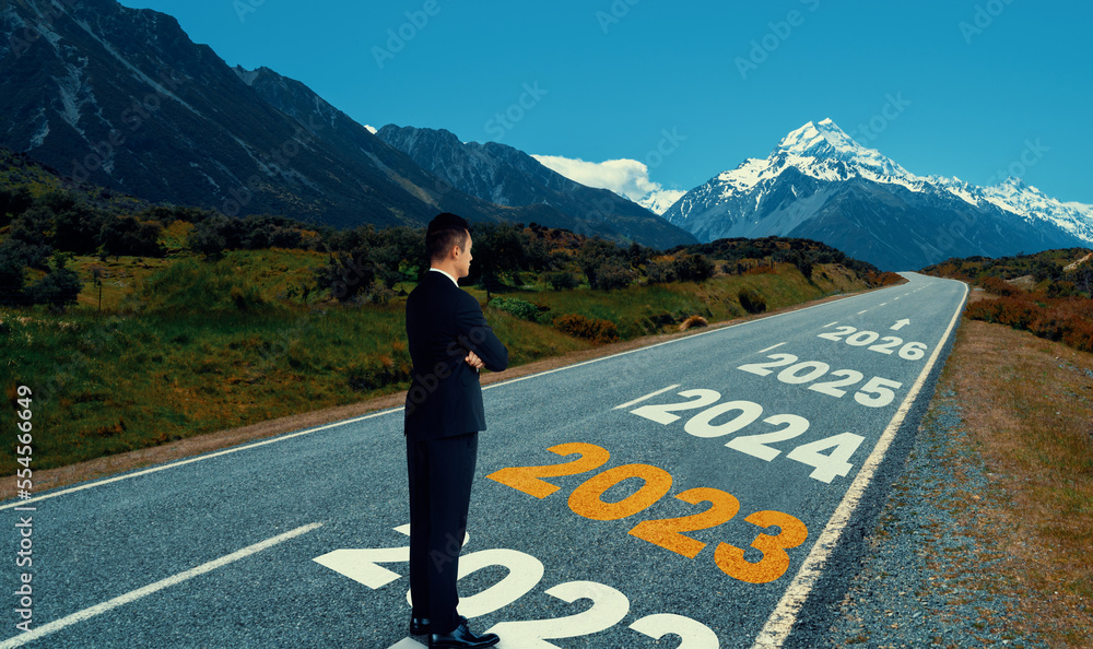 The 2023 New Year journey and future vision concept . Businessman ...
