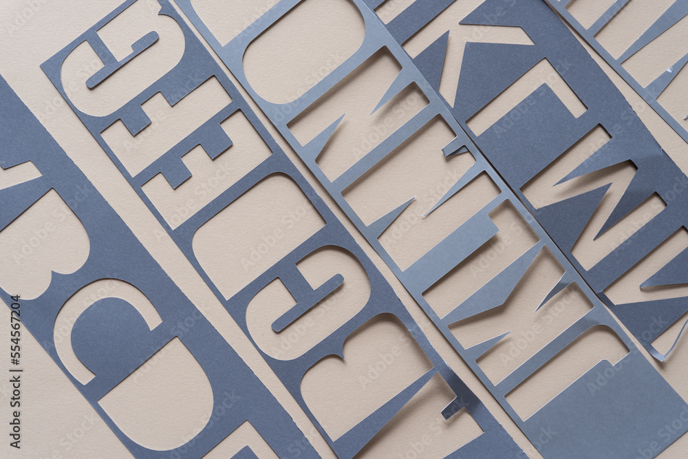 background with paper stencils and letters cutout Stock Photo | Adobe Stock