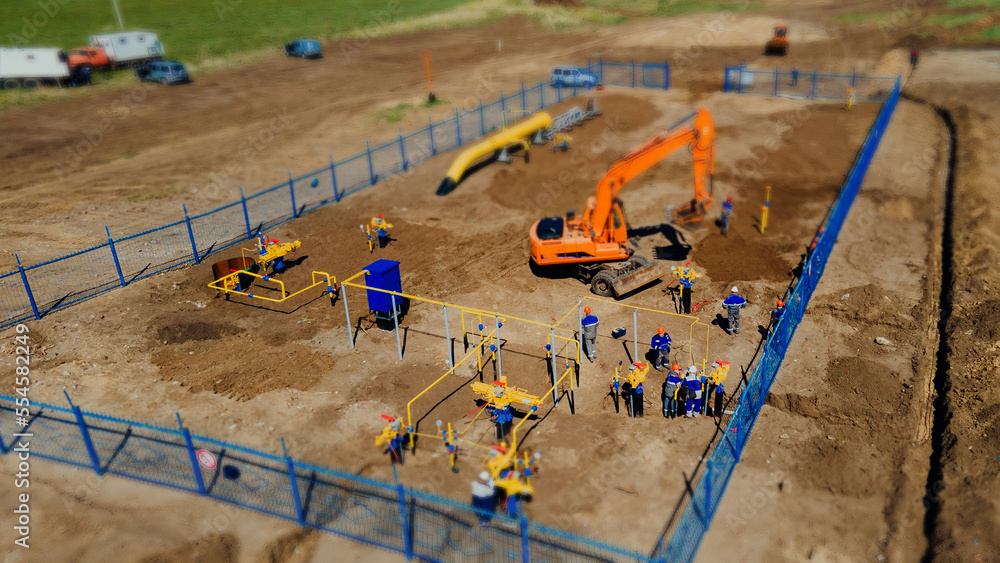 Aerial view excavator and construction workers working on construction ...
