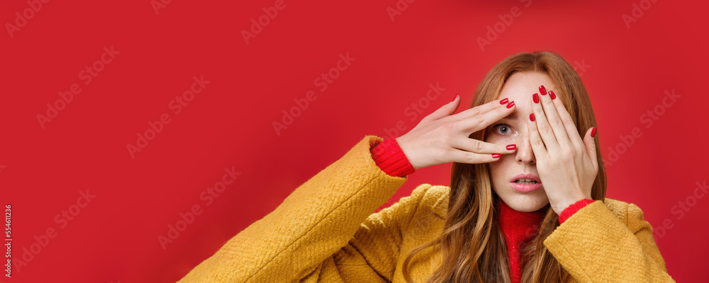 Stunned and shocked redhead woman cannot believe what terrible thing ...