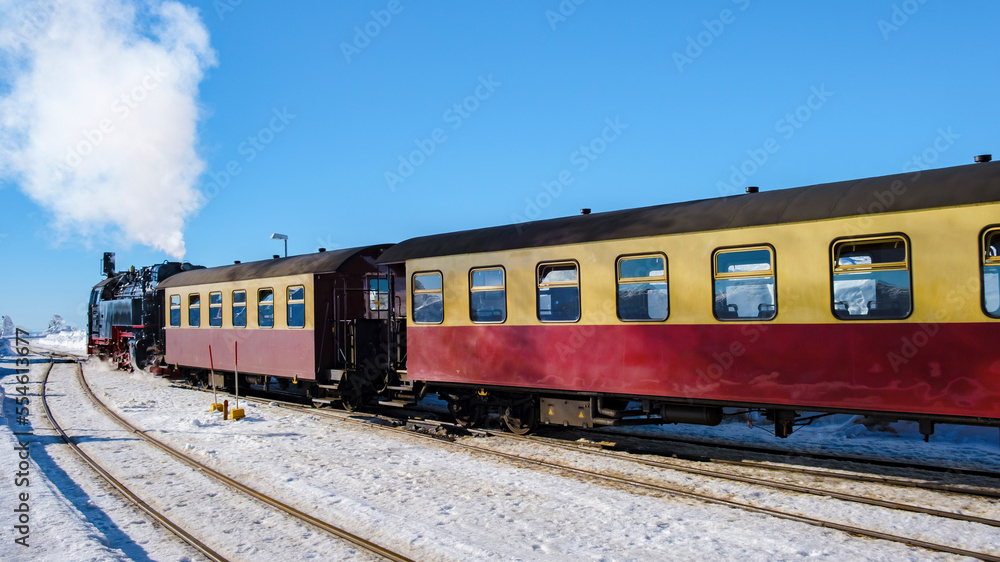 Steam train during winter in the snow in the Harz national park Germany ...