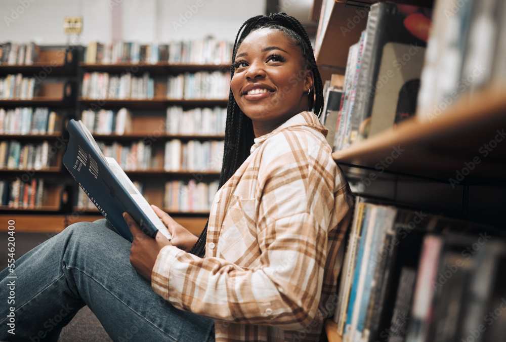 University, education and black woman in library reading book. College ...