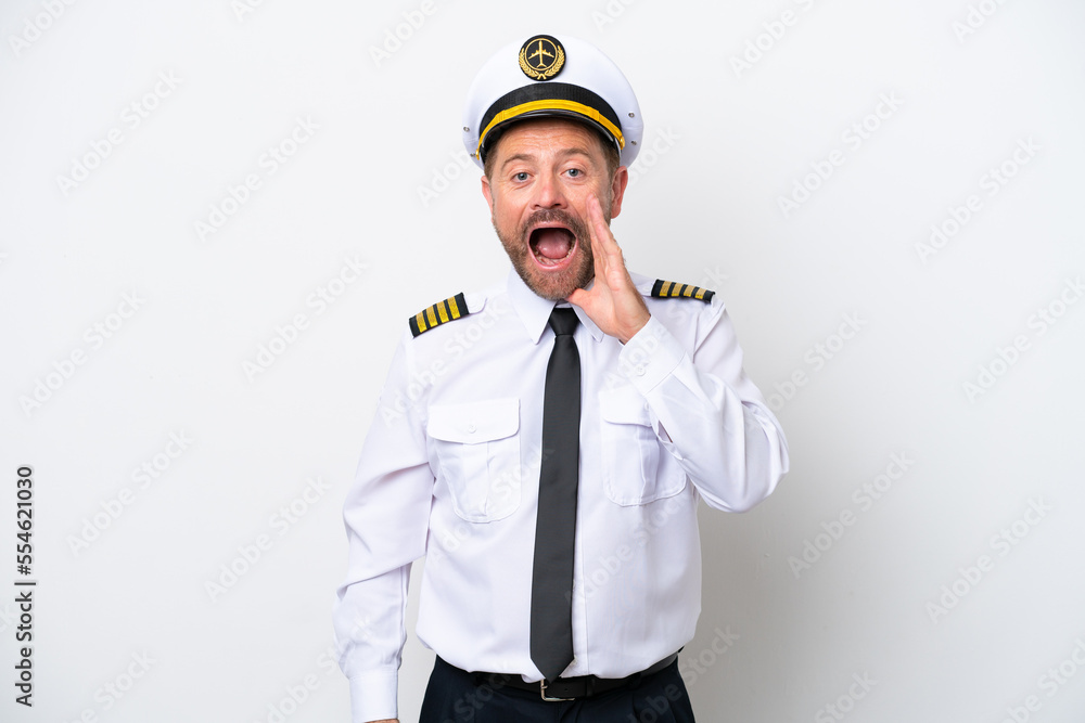 Airplane middle age pilot isolated on white background with surprise ...