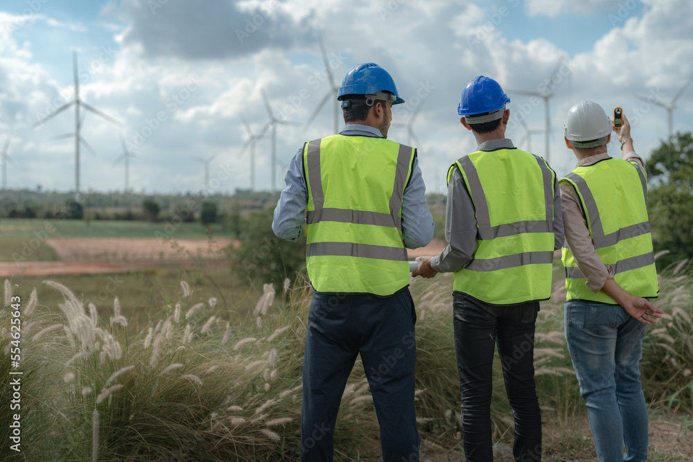 Asian engineer working in fieldwork outdoor. Workers check and inspect ...