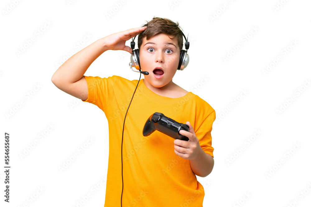 Little caucasian kid playing with a video game controller over isolated ...