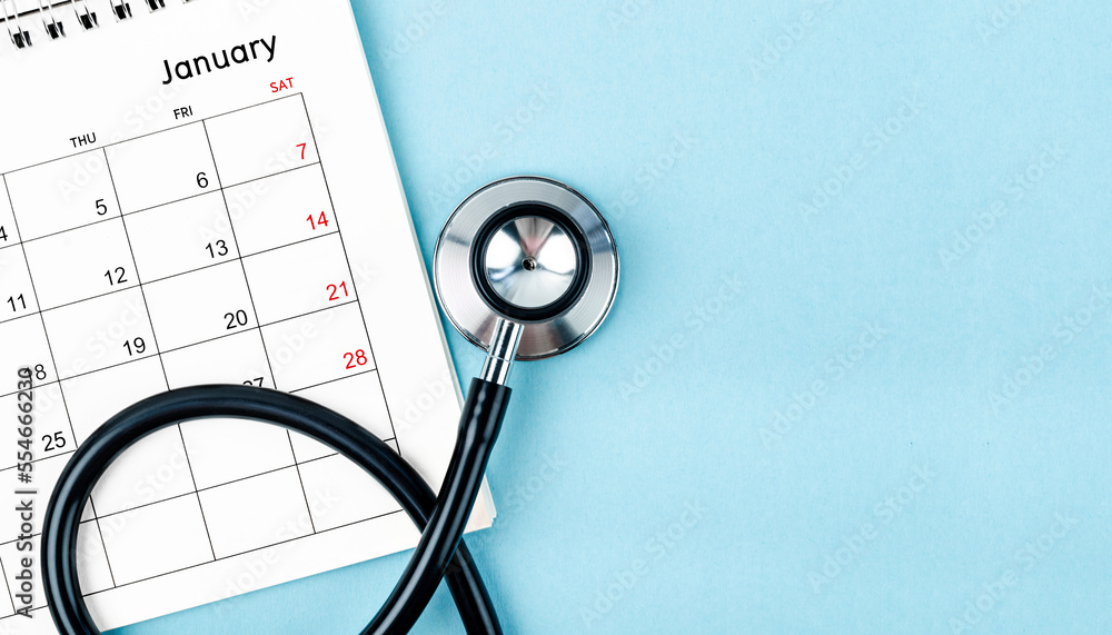 Top view of stethoscope medical and calendar with empty space on the ...