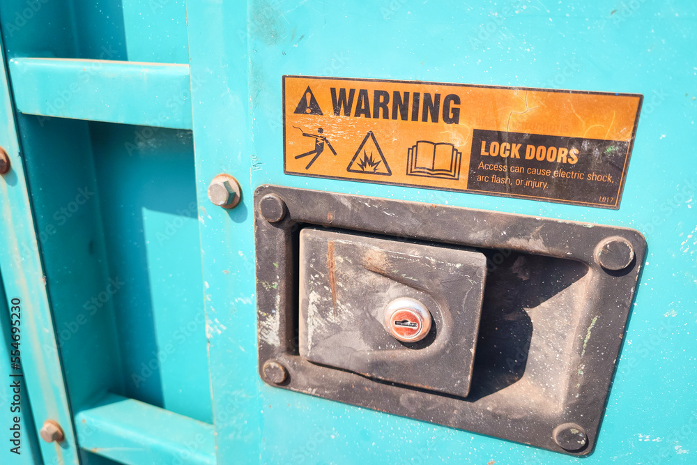 Instruction warning information sign on the door handle of the ...