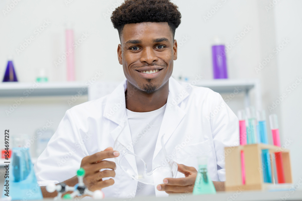 lab man pouring fluids Stock Photo | Adobe Stock