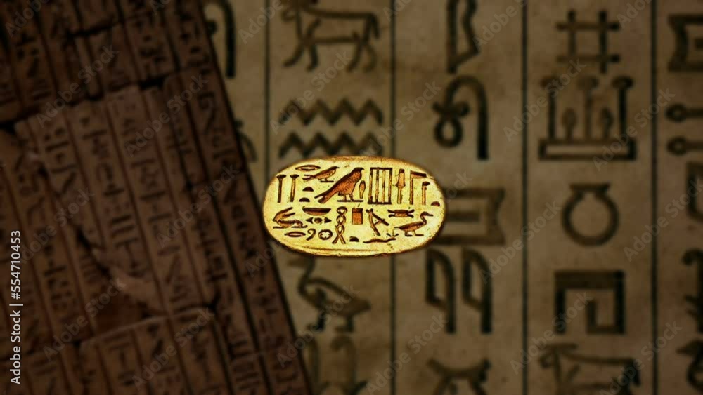 gold of ancient Egypt, Egyptian hieroglyphs on an ancient gold coin ...