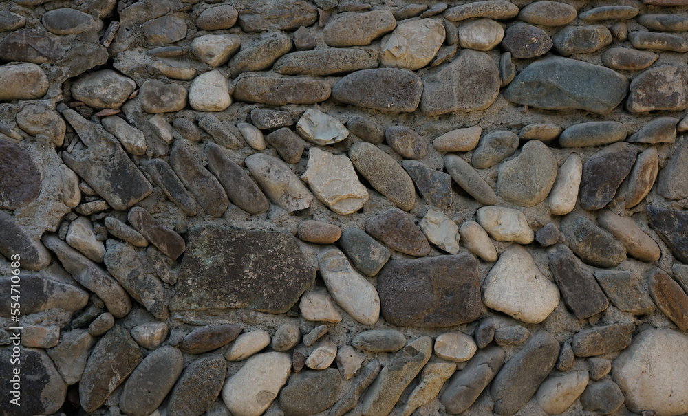 Background, texture, stone wall of round stones cobblestones bricks ...