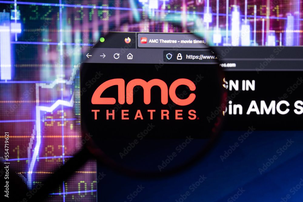 AMC Theatres company logo on a website with blurry stock market ...