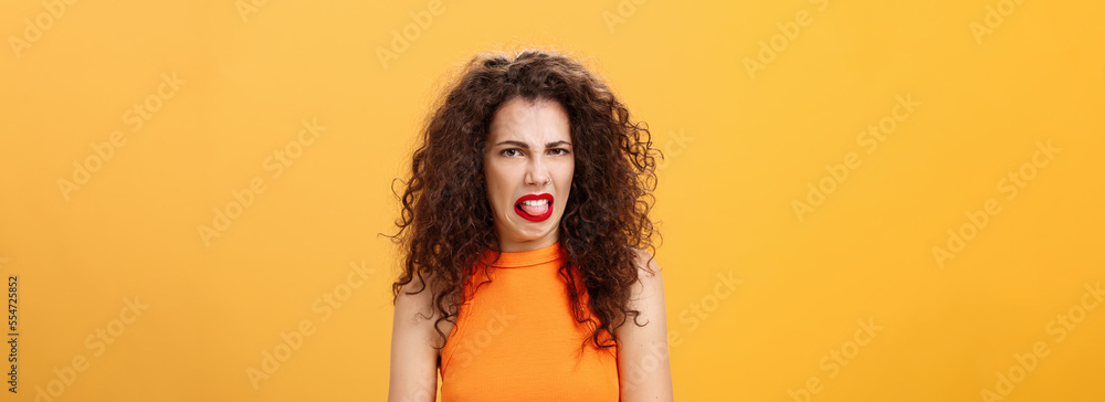 Girl being disgusted with row food sticking out tongue and frowning ...