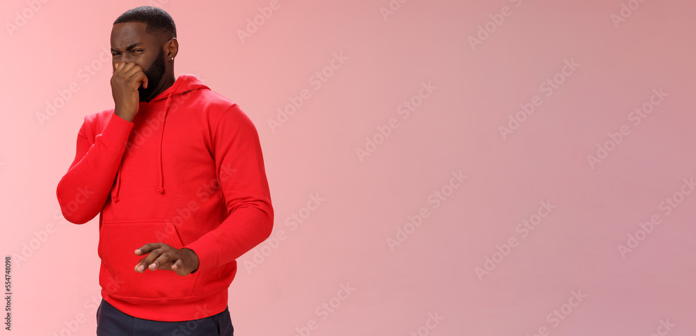 Intense bothered african american man feel unwell close nose cringe ...