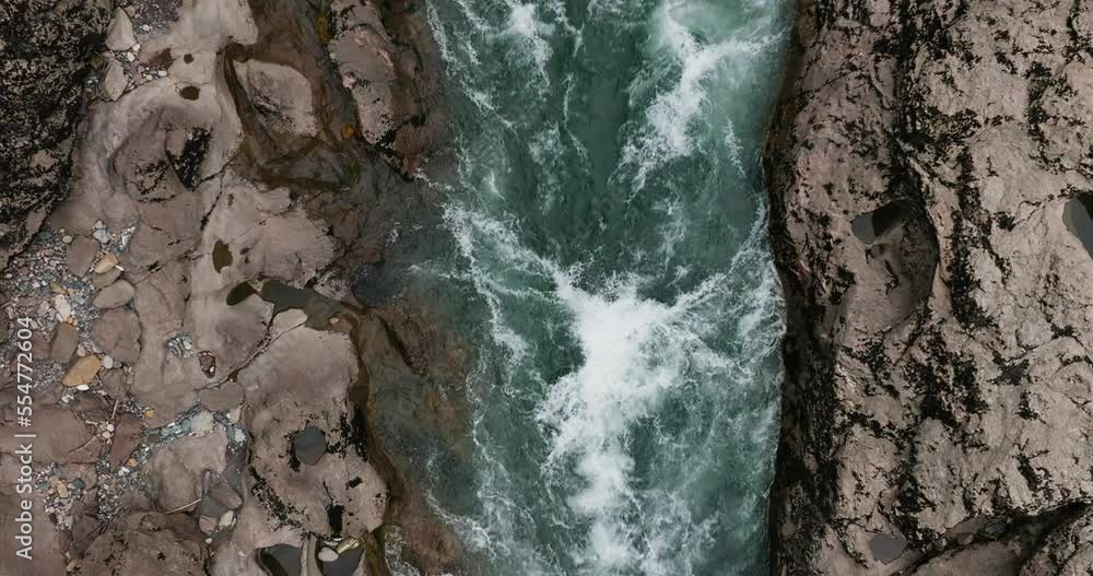 Mountain river. A rapid flow of clean water between rocks. Bubbling ...