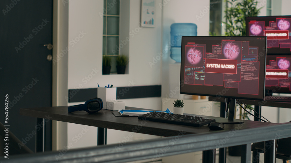 Fotka „Multiple monitors displaying computer malfunction and security breach in empty ...