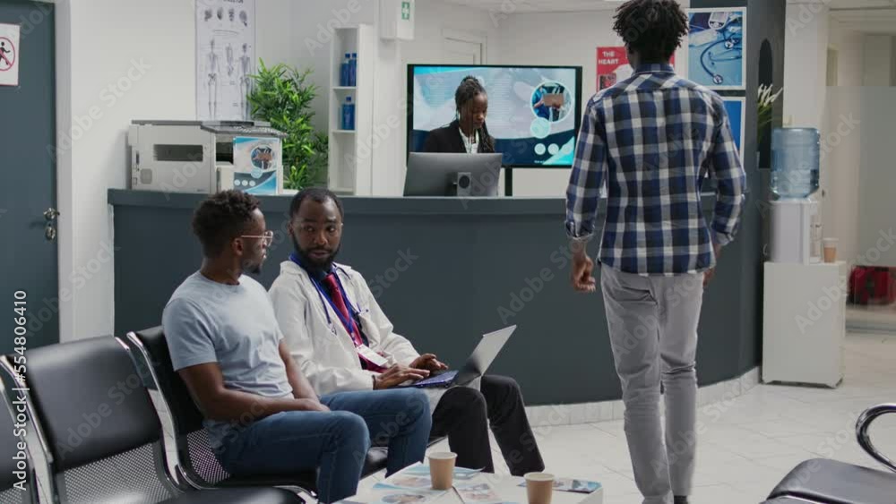 Male physician explaining disease diagnosis to patient in hospital ...