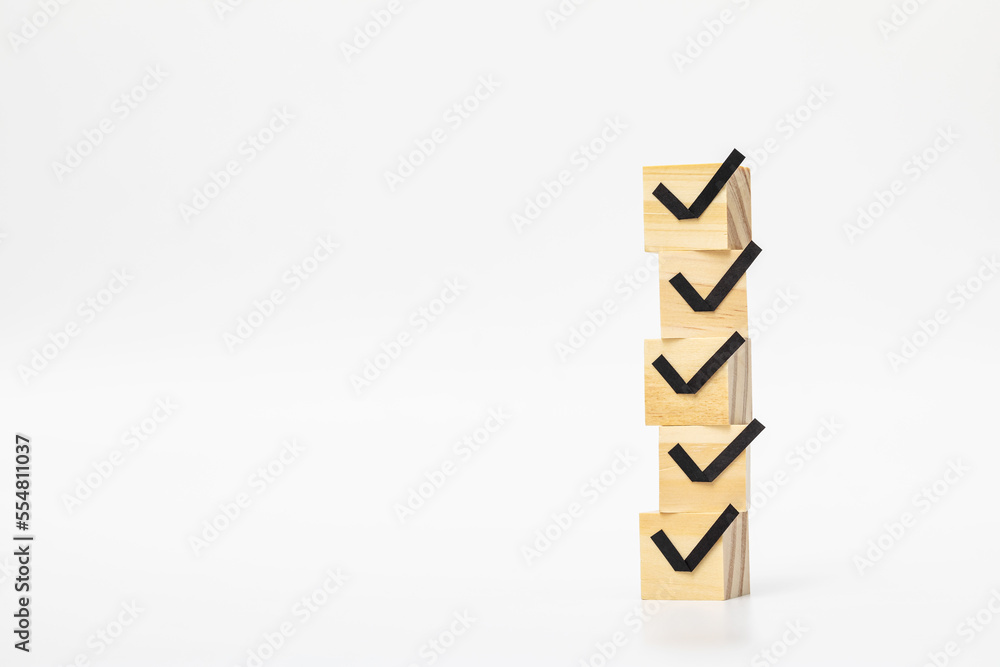 wooden block with check mark on white background Stock Photo | Adobe Stock
