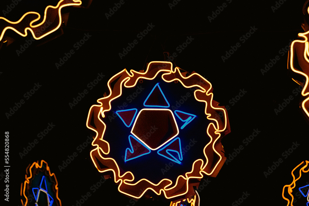 Neon lights shaped into traditional parol, a Filipino ornamental ...