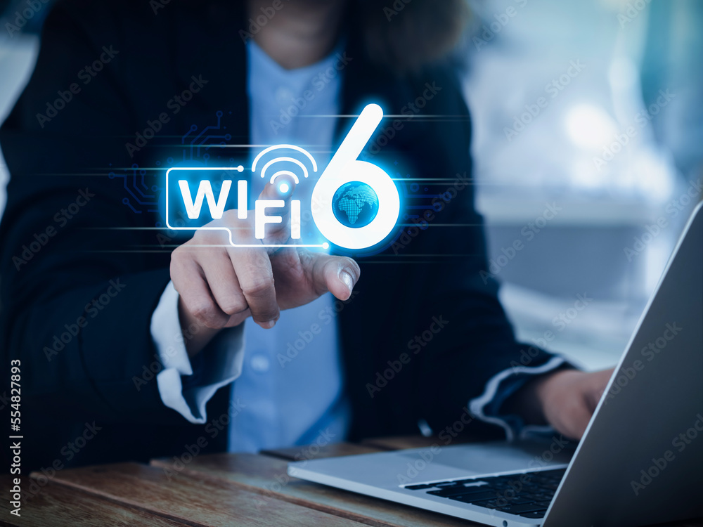 Wi-Fi 6 speed logo glowing on virtual screen while businesswoman ...